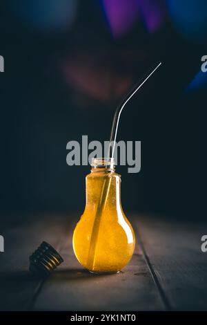 Creative bulb glass with cocktail. Power, science, bitcoin ...