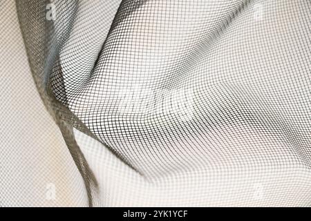 Curved mesh close up as ofn,mosquito black mesh on white background ...