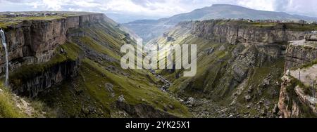 An epic view of a huge mountain rift, the terrain is covered with ...