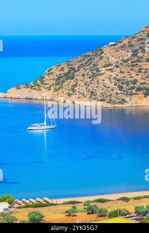 The seaside village and the beach of Vathi of Sifnos island at sunset ...