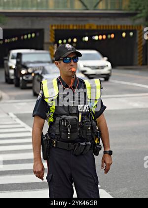 Toronto Canada / Toronto Policeman directing traffic in Downtown ...