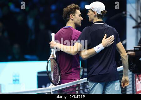 Jannik Sinner of Italy shakes hand with mascot kids during the Round ...