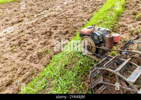 Tractor-Image of traditional farming equipment in a rural green field ...