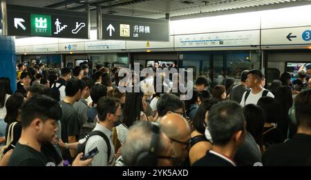 Hong Kong 2024 May 2: crowded of people inside the station of MTR. MTR ...