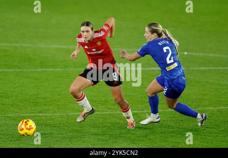 Manchester United's Grace Clinton (left) scores her sides first goal ...