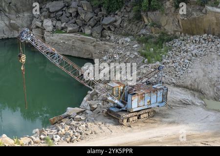Mining industry quarry with working mining machines Stock Photo - Alamy