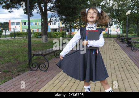 Happy primary school and books Stock Photo - Alamy