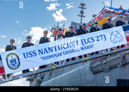 The crew of the USS Nantucket (LCS 27) stands in formation on the ...
