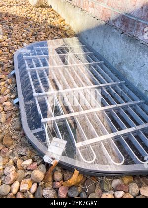 Custom Plexiglass Window Well Cover in Late Fall Stock Photo - Alamy