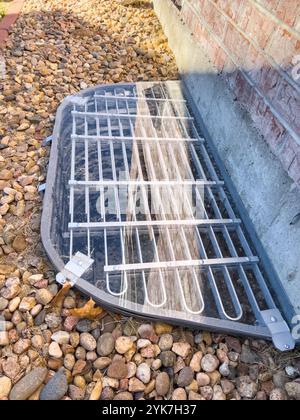 Custom Plexiglass Window Well Cover in Late Fall Stock Photo - Alamy