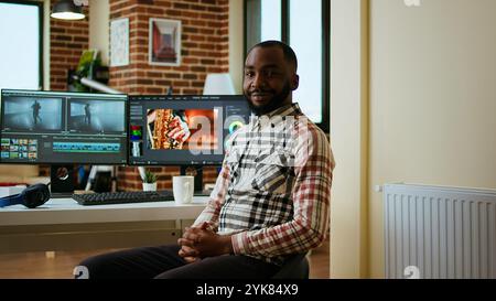 African american male filmmaker works with creative editing software ...