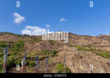 Traditional Bhutanese building complex nestled on a hillside, Paro ...