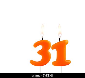 Candle number 31 - Lit birthday candle on white background Stock Photo ...