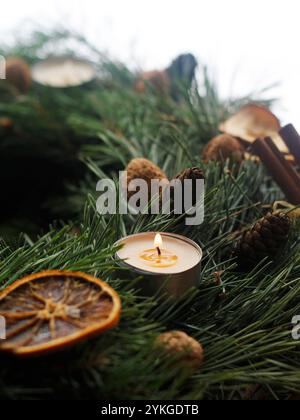 Candle decorated with cinnamon sticks. Christmas arrangement. Festive ...