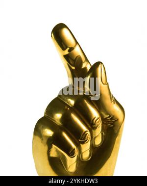 'GOLDFINGER' gold finger hand with pointing index finger on white ...
