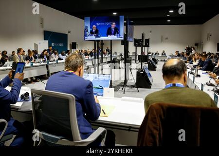 Simon Stiell, United Nations climate chief, second from left, listens ...