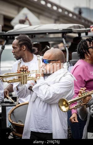 Musicians play in the Second Line parade moving through the streets of ...