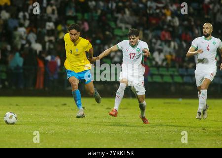 FRANCEVILLE, GABON - NOVEMBER 15: Anthony Oyono of Gabon and Abdessamad ...