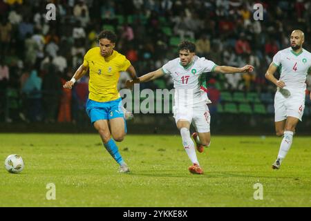 FRANCEVILLE, GABON - NOVEMBER 15: Anthony Oyono of Gabon and Abdessamad ...