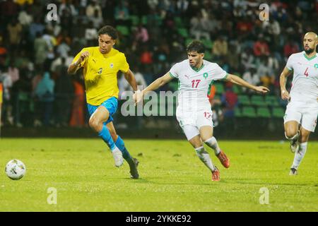 FRANCEVILLE, GABON - NOVEMBER 15: Anthony Oyono of Gabon and Abdessamad ...