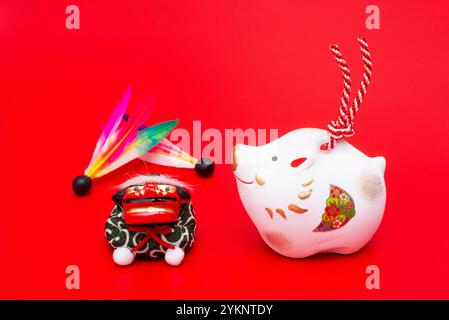 Wild boar and lion dance figures and feathers Stock Photo - Alamy