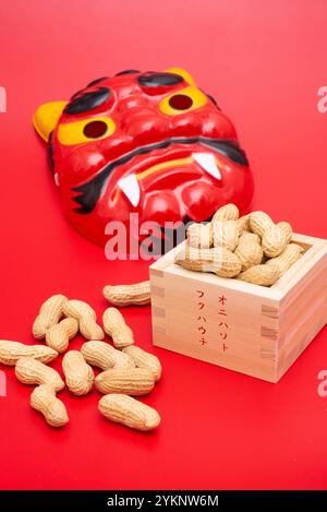 Groundnut in Masu Box with Red Devil Mask Stock Photo - Alamy