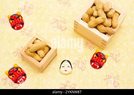 Peanuts in Masu Box with masks of Otafuku and Red Devil Stock Photo - Alamy