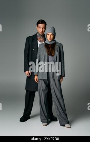 Fashionable duo showcases contemporary style while posing in a chic ...