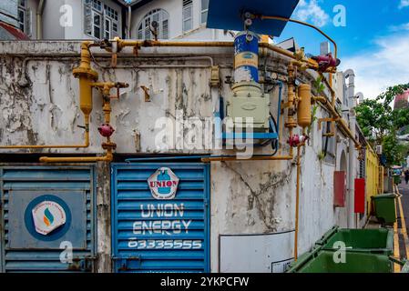 Gas supply and external plumbing connections at the rear of a shophouse ...