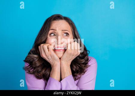Photo of scared brunette lady hands ears wear colorful t-shirt isolated ...