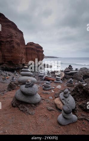 Rocks piled up on the beach at Lyme Regis to form a breakwater Stock ...
