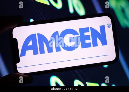 In this photo illustration, the Amgen company logo is seen displayed on ...