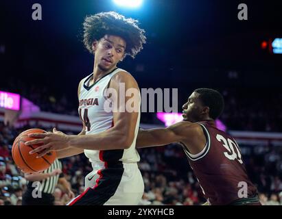 Georgia forward Asa Newell (14) drives past Auburn guard Tahaad ...
