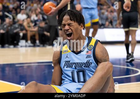 Marquette forward Damarius Owens (10) battles for a loose ball with ...