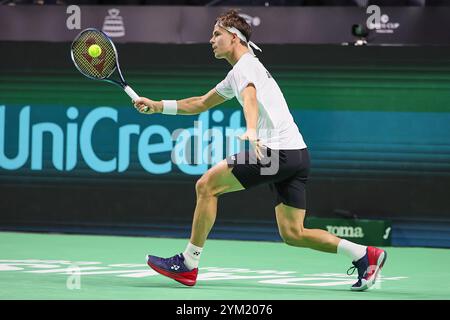 Gabriel Diallo, of Canada, returns the ball against Ben Shelton during ...