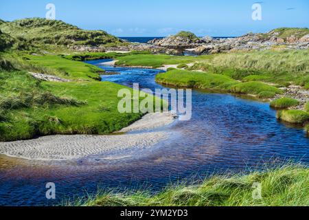 River flowing into Red Rocks beach (Eilean Bhuigistile) on Isle of Coll ...