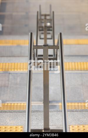 An aluminum ladder on the stone wall by the stream reflects in the ...