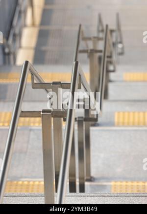 An aluminum ladder on the stone wall by the stream reflects in the ...