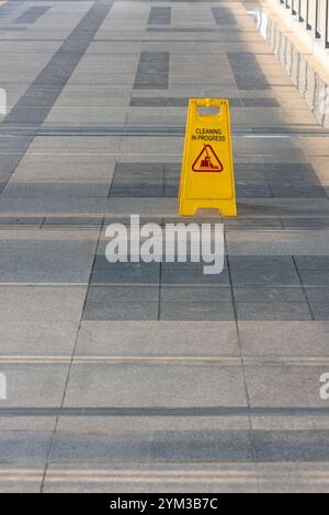 Sign showing warning of cleaning process area, Yellow sign that alerts ...