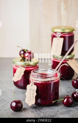 Fresh cherries in small jar Stock Photo - Alamy