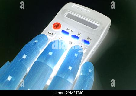 Robotic Hand Using Calculator In Office Stock Photo - Alamy