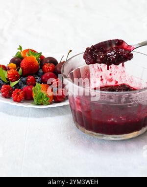 Traditional artisanal jam made from organic red fruits. Creative food ...