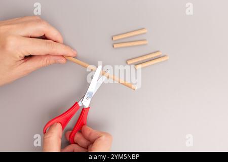 scissors cutting paper straw step in DIY project quick assembly ...
