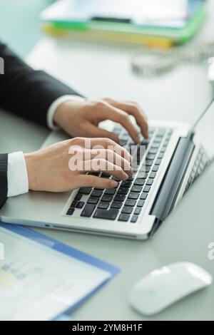Businessman's hand on computer Stock Photo - Alamy