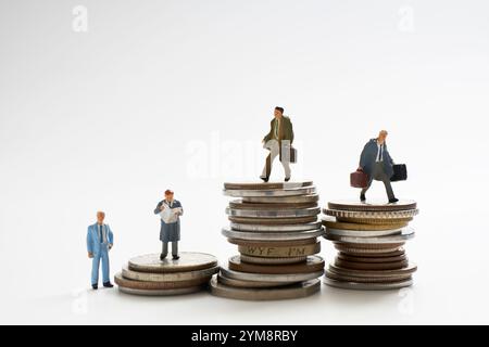 Coins and miniature dolls Stock Photo - Alamy