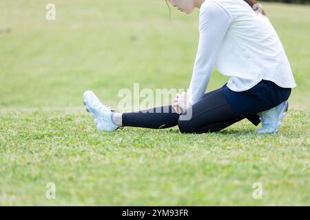 Young woman doing preparatory exercise before exercise Stock Photo - Alamy