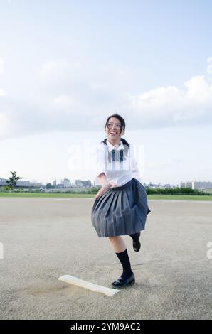 Female student pretending to throw the ball Stock Photo - Alamy