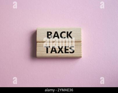 Back Taxes symbol. Concept word Back Taxes on wooden blocks. Beautiful ...