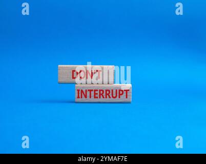 Dont interrupt symbol. Concept word Dont interrupt on wooden blocks ...
