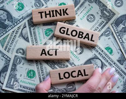 Think global act local symbol. Wooden blocks with words Think global ...